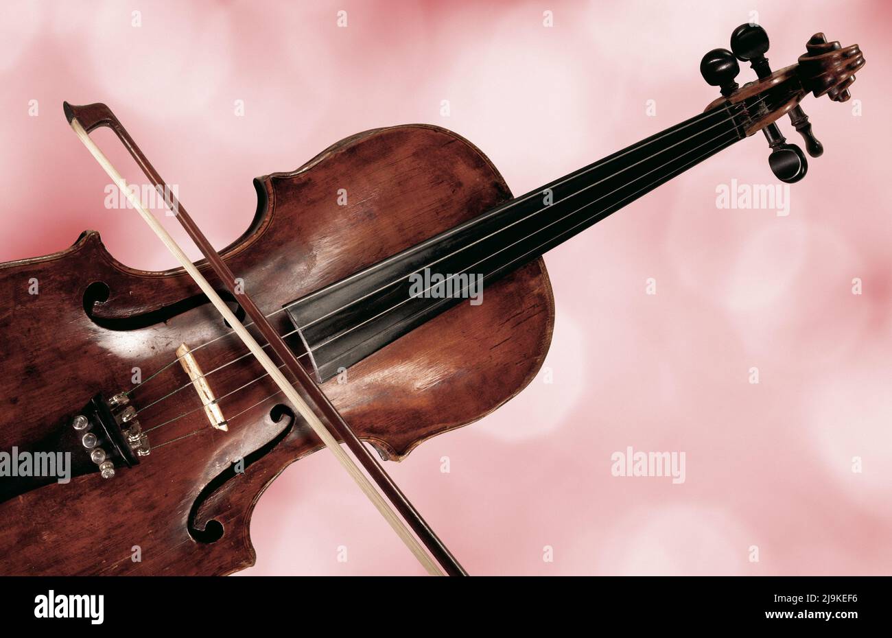 Detail of a Body of violin and bow on Red blurred background Stock ...