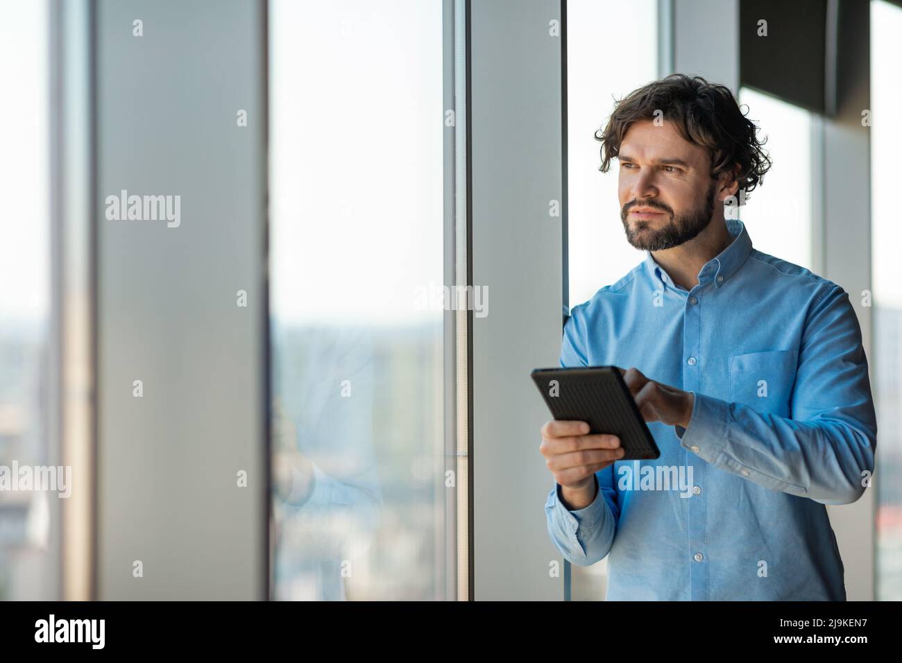 Portrait focused businessman using tablet hi-res stock photography and ...