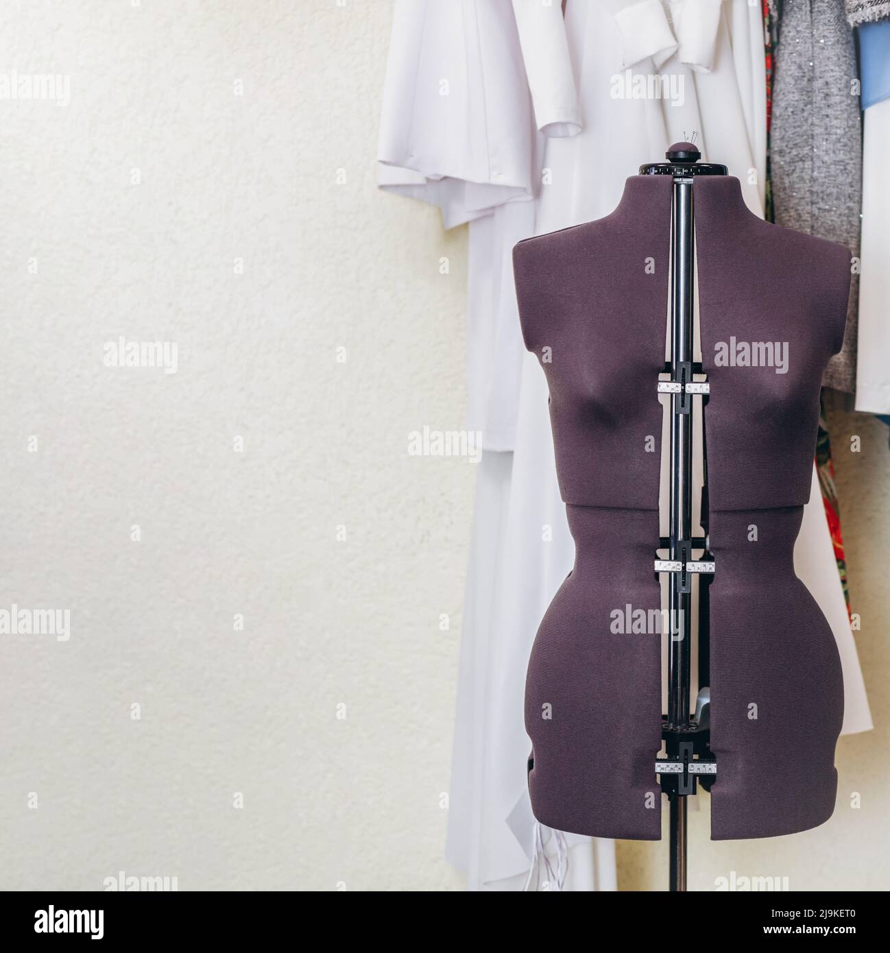 A professional mannequin in an atelier against the background of ...