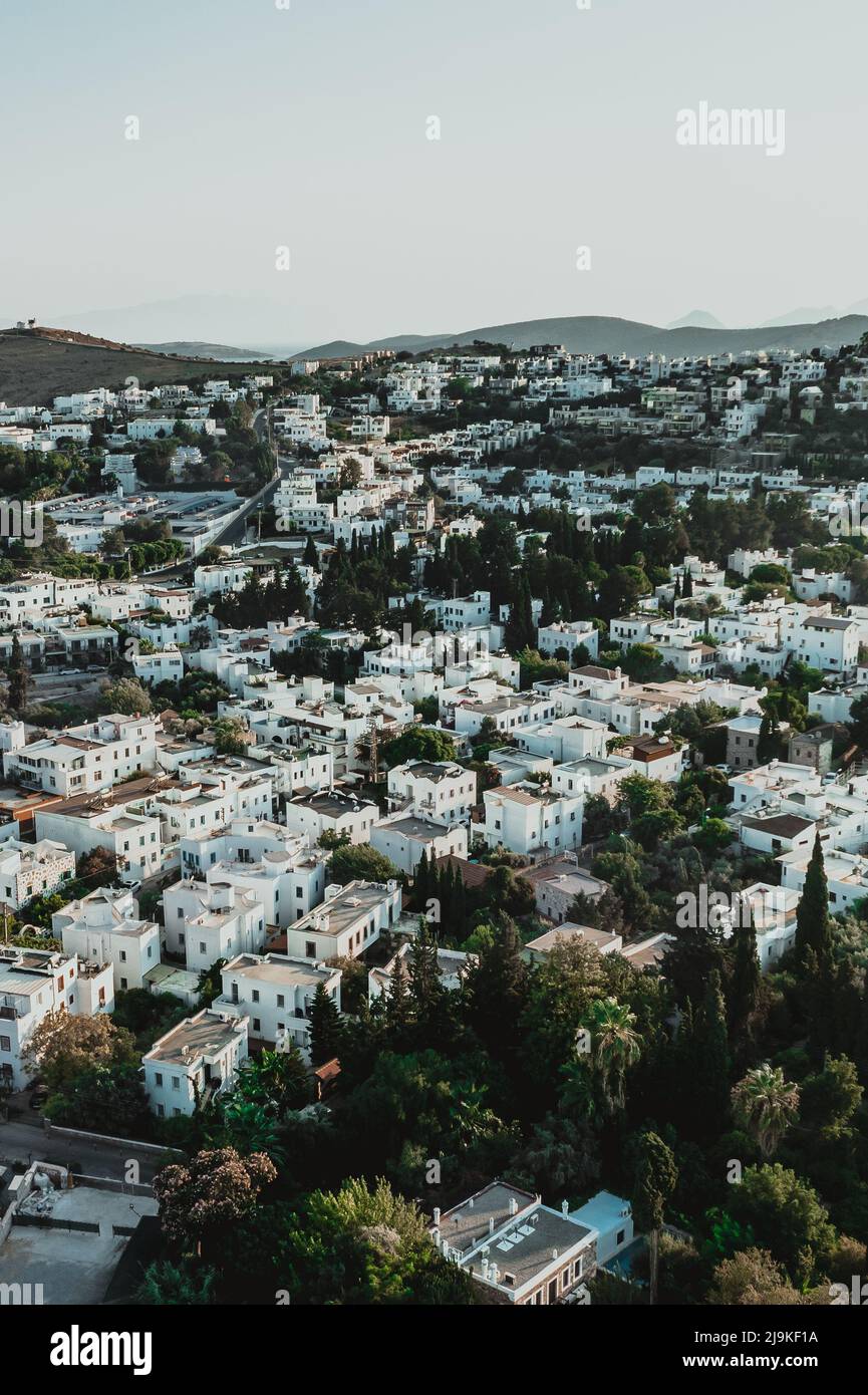 Aerial landscape of white villa homes in Bodrum Turkey during sunset ...