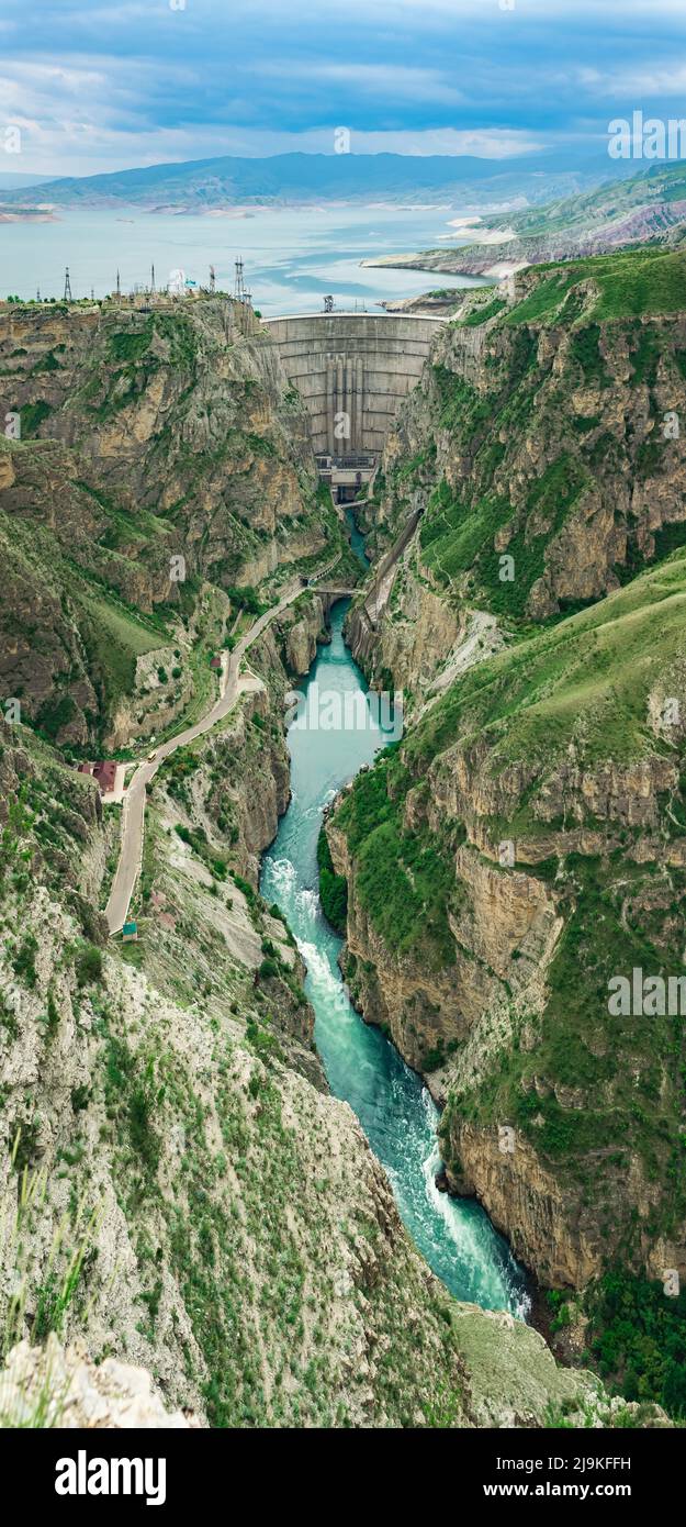 view of the arch dam with a spillway in the canyon Stock Photo - Alamy