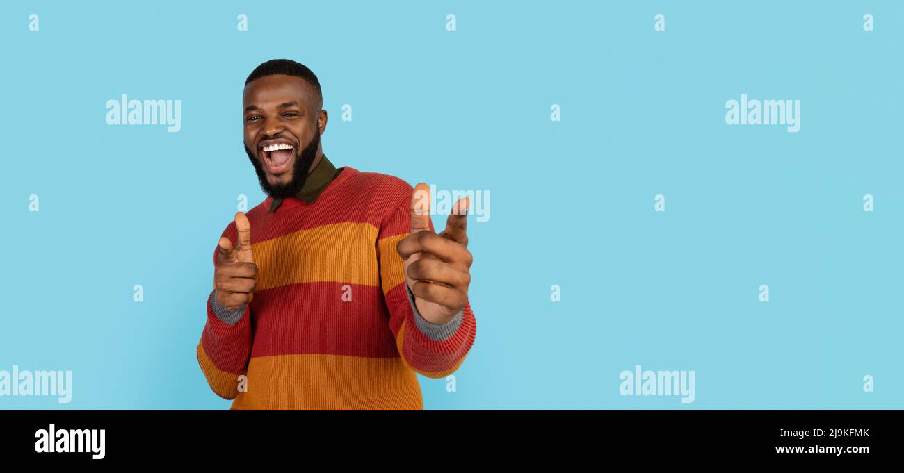 Gotcha. Cheerful Handsome Black Man Poiting At Camera With Two Hands ...