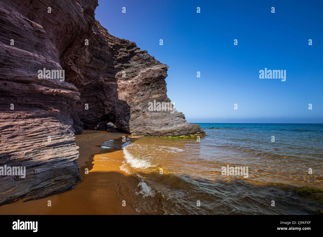 Beach with crystalline and transparent waters of bluish and greenish ...