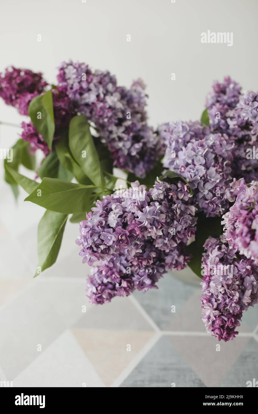 Home interior decor, bouquet of lilacs in a vase on table Stock Photo ...