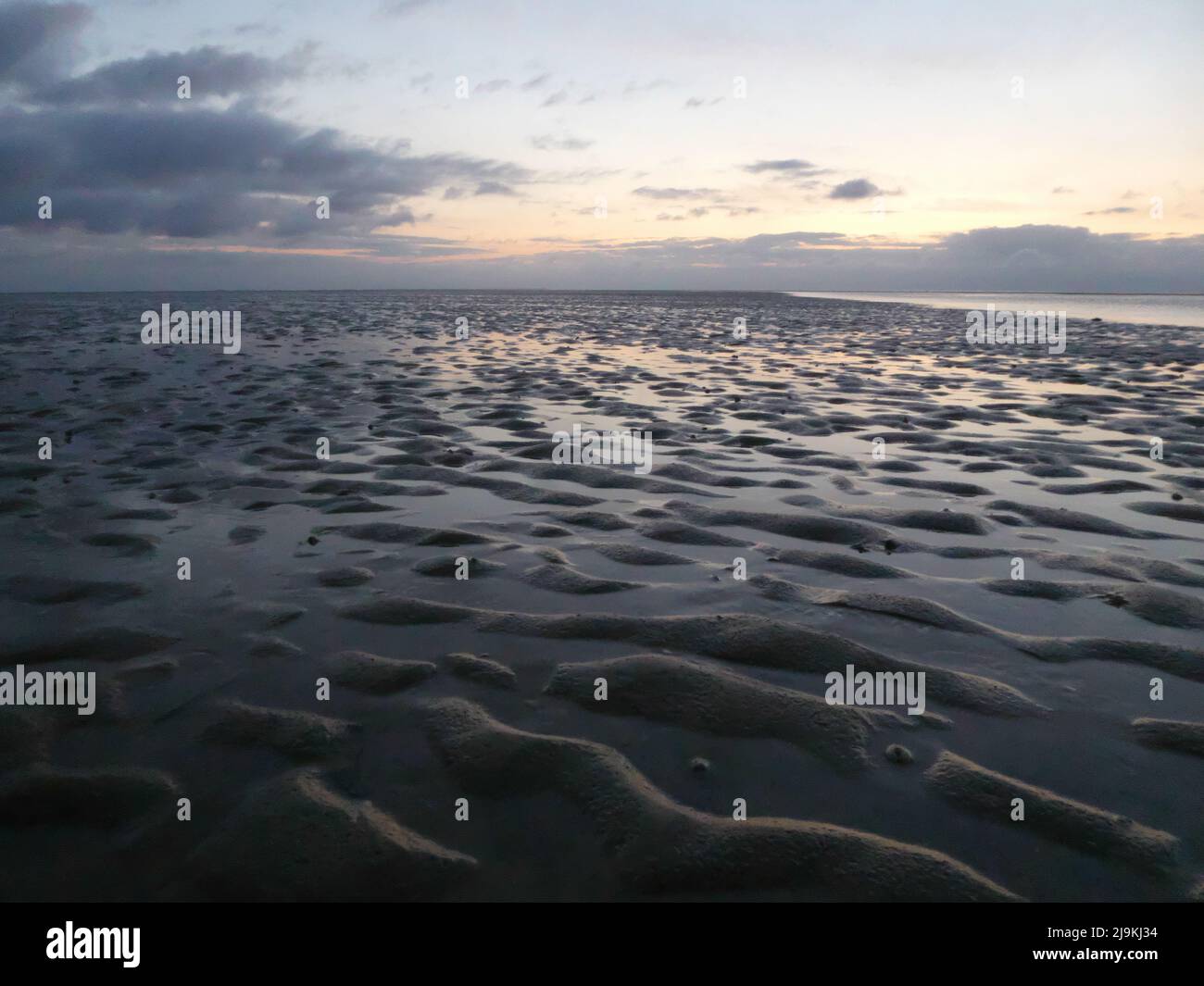 The beautiful tideland during low tide and sunrise Stock Photo - Alamy