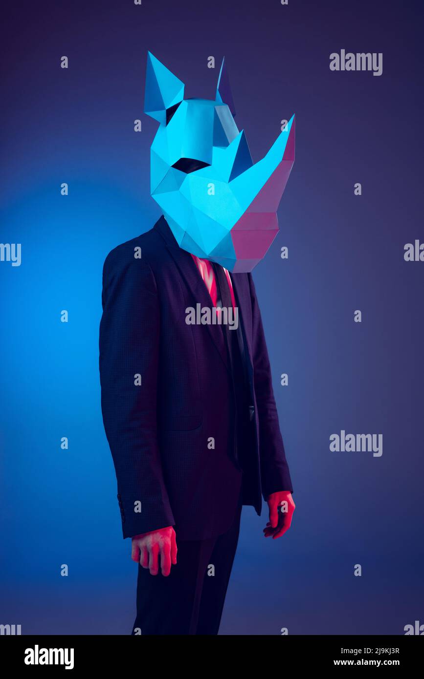 Creative portrait of young stylish man in business suit with cardboard ...