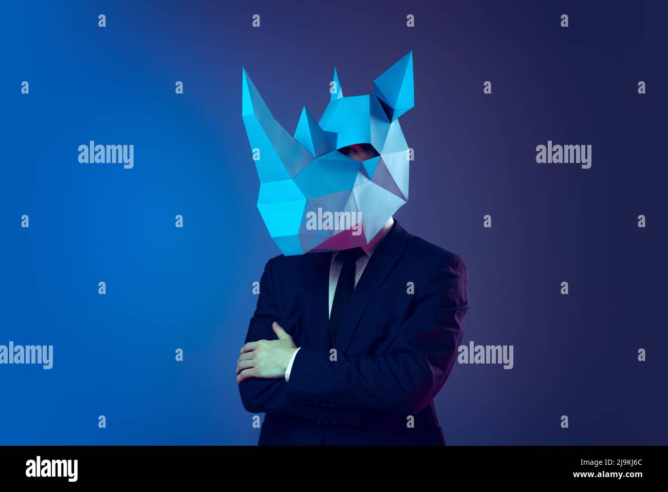 Creative portrait of young stylish man in business suit with cardboard ...