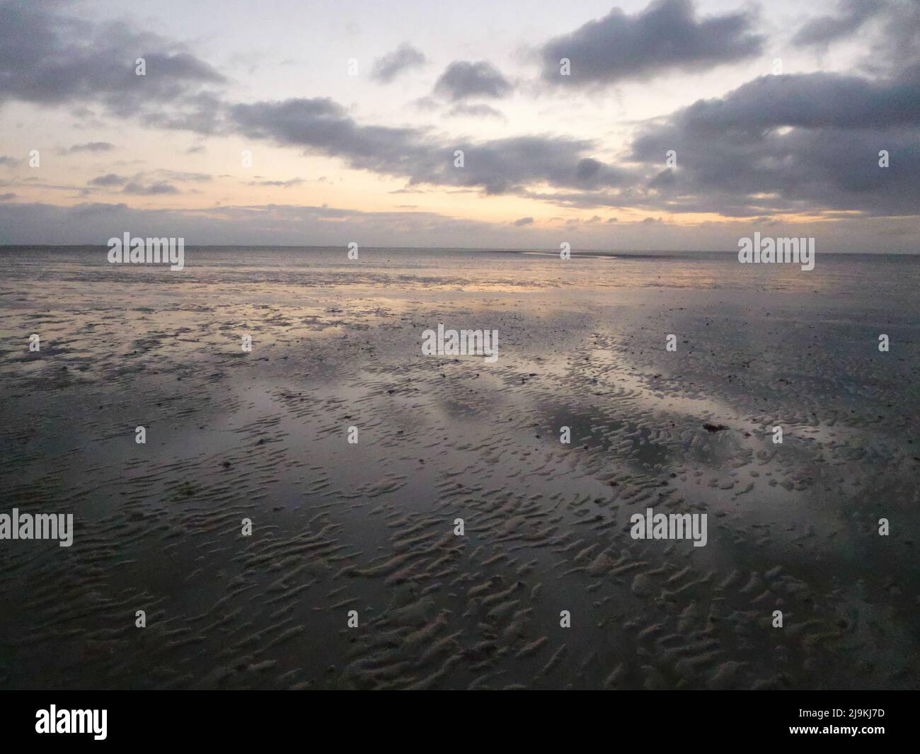 The beautiful tideland during low tide and sunrise Stock Photo - Alamy