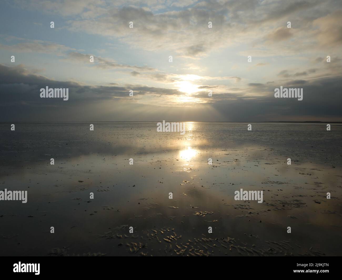 The beautiful tideland during low tide and sunrise Stock Photo - Alamy