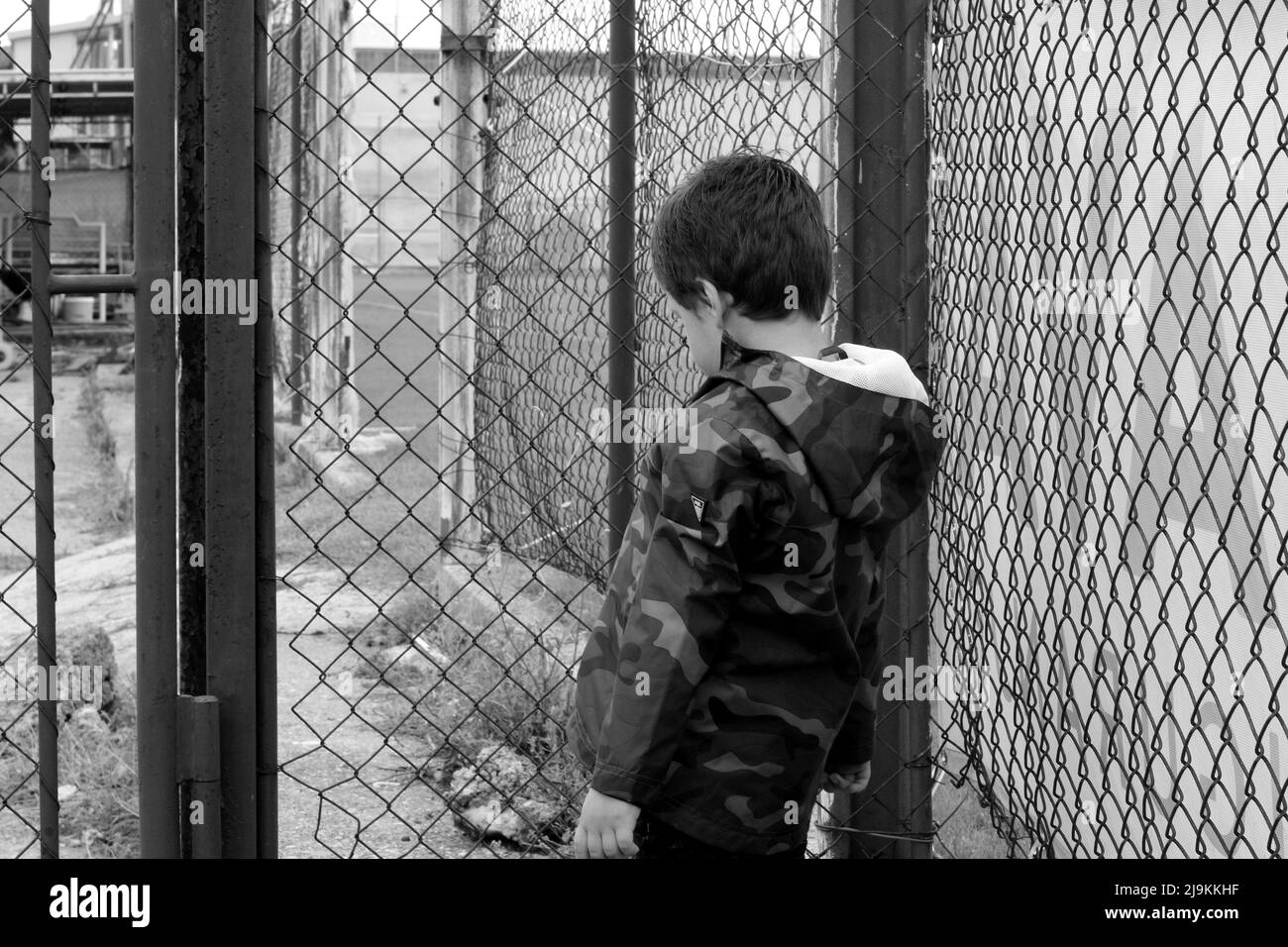 the boy behind the fence Stock Photo - Alamy