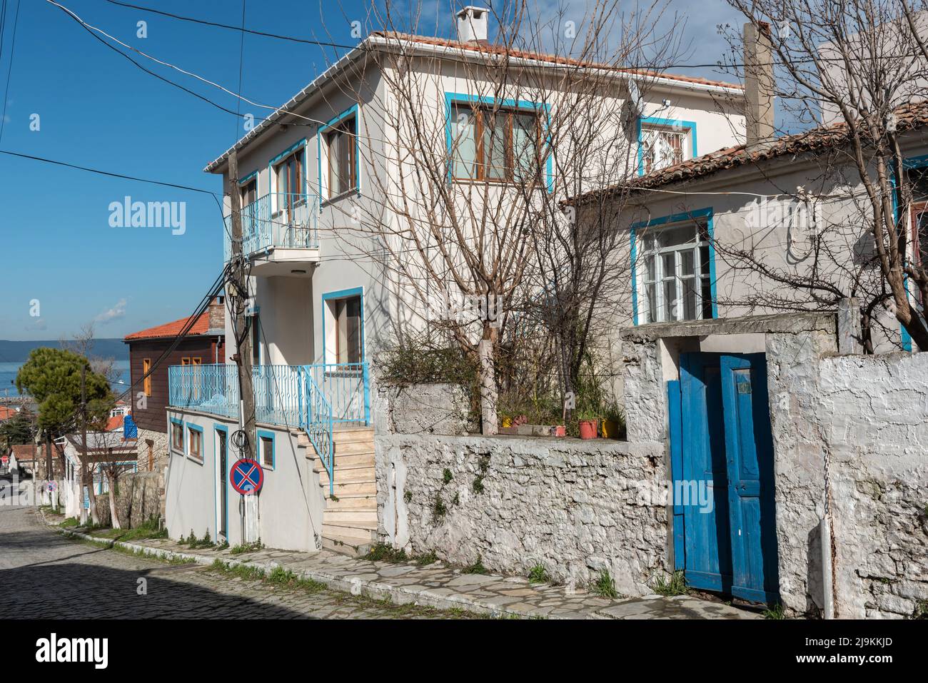 Pretty blue painted houses in the village of Kilitbahir on the ...