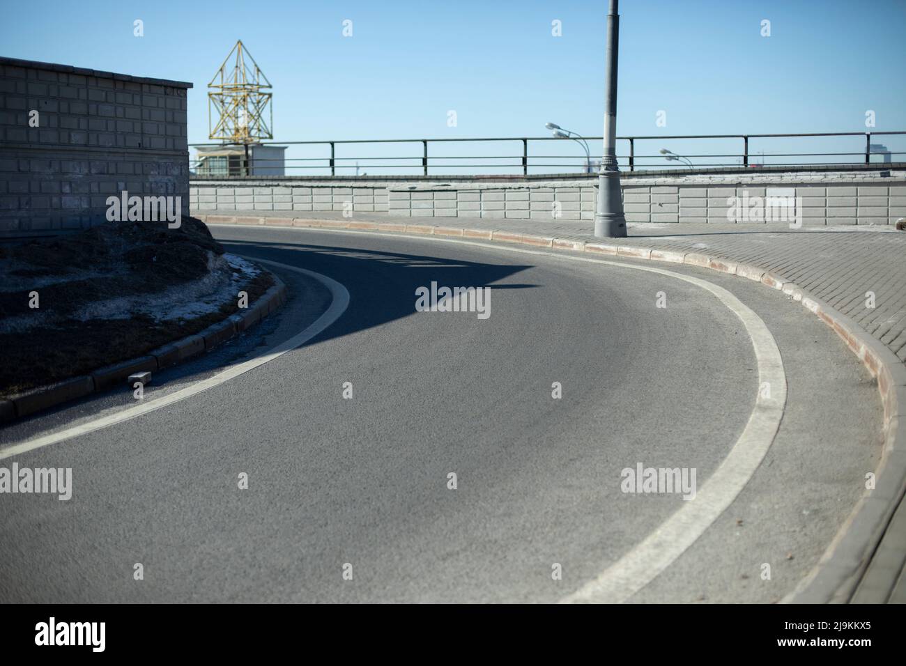 Bend in road. Sharp turn. One-lane traffic in city Stock Photo - Alamy