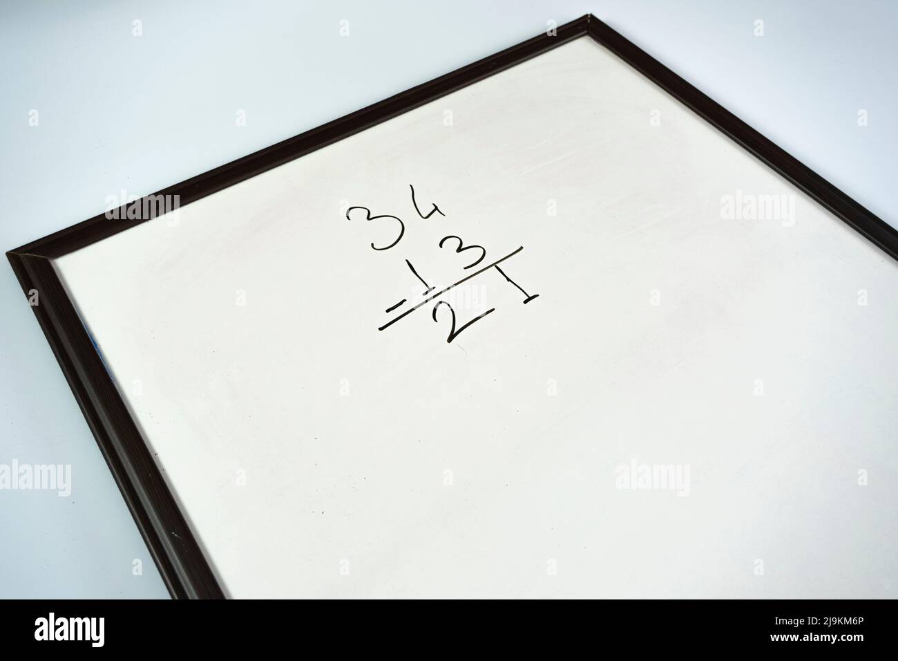 Subtraction calculation with black color marker on whiteboard, math ...