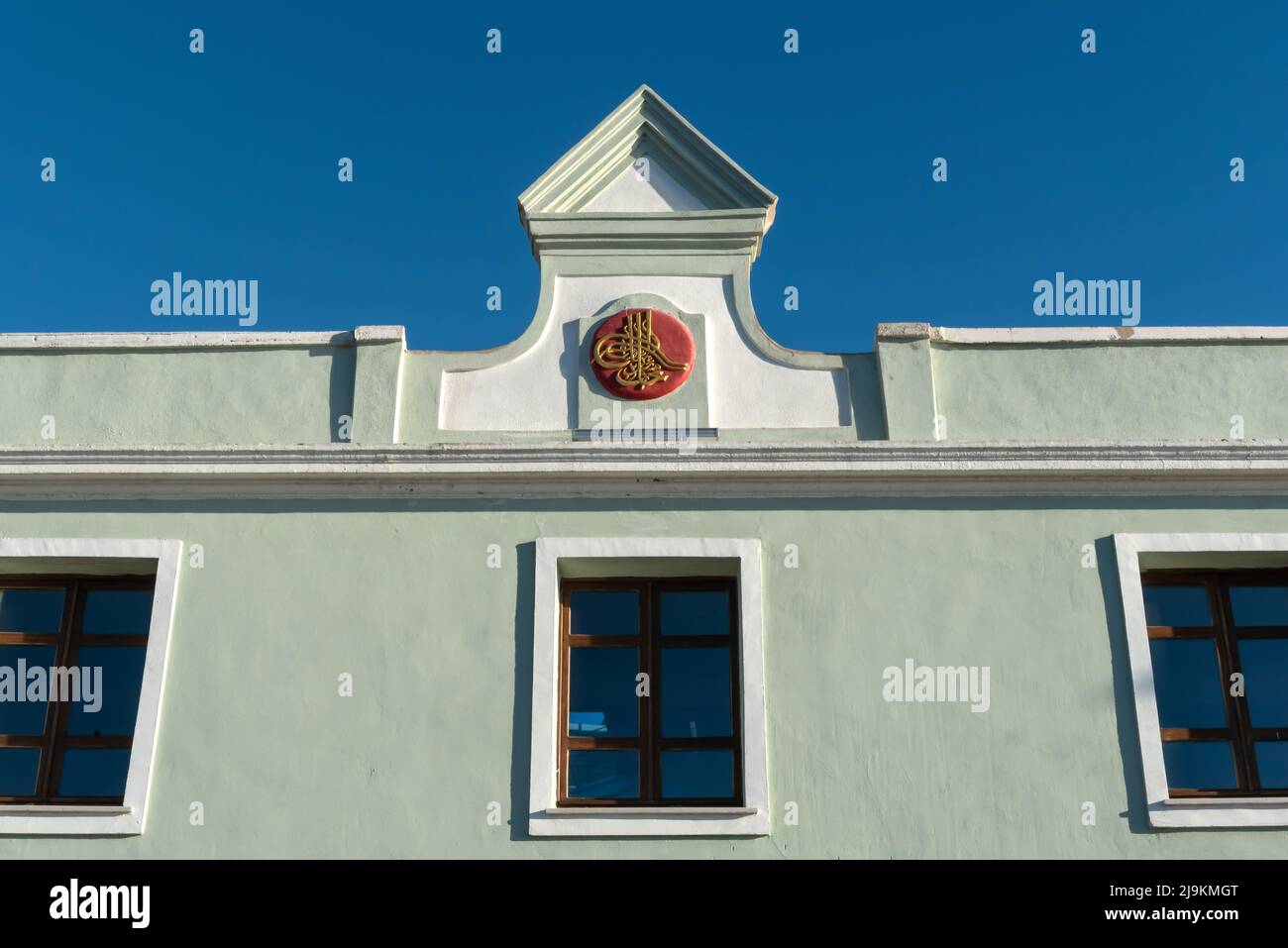 Ottoman crest on the Turkish Customs House at Canakkale Port, beside ...