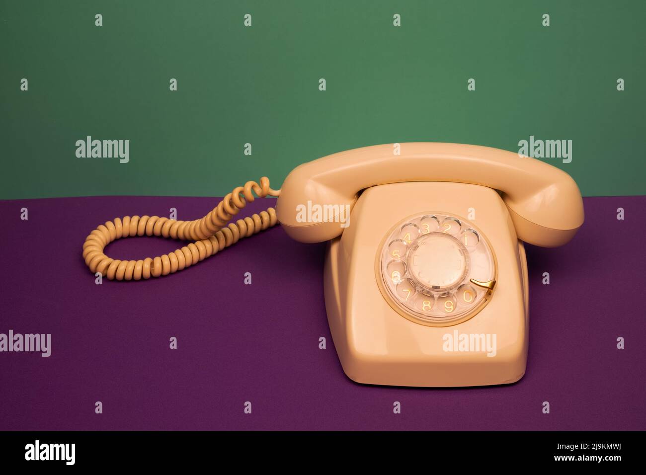Vintage roulette phone with a purple and green background Stock Photo ...