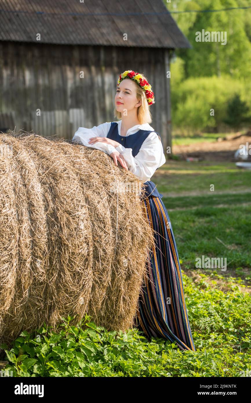 Woman in traditional clothing posing on nature in village Stock Photo ...