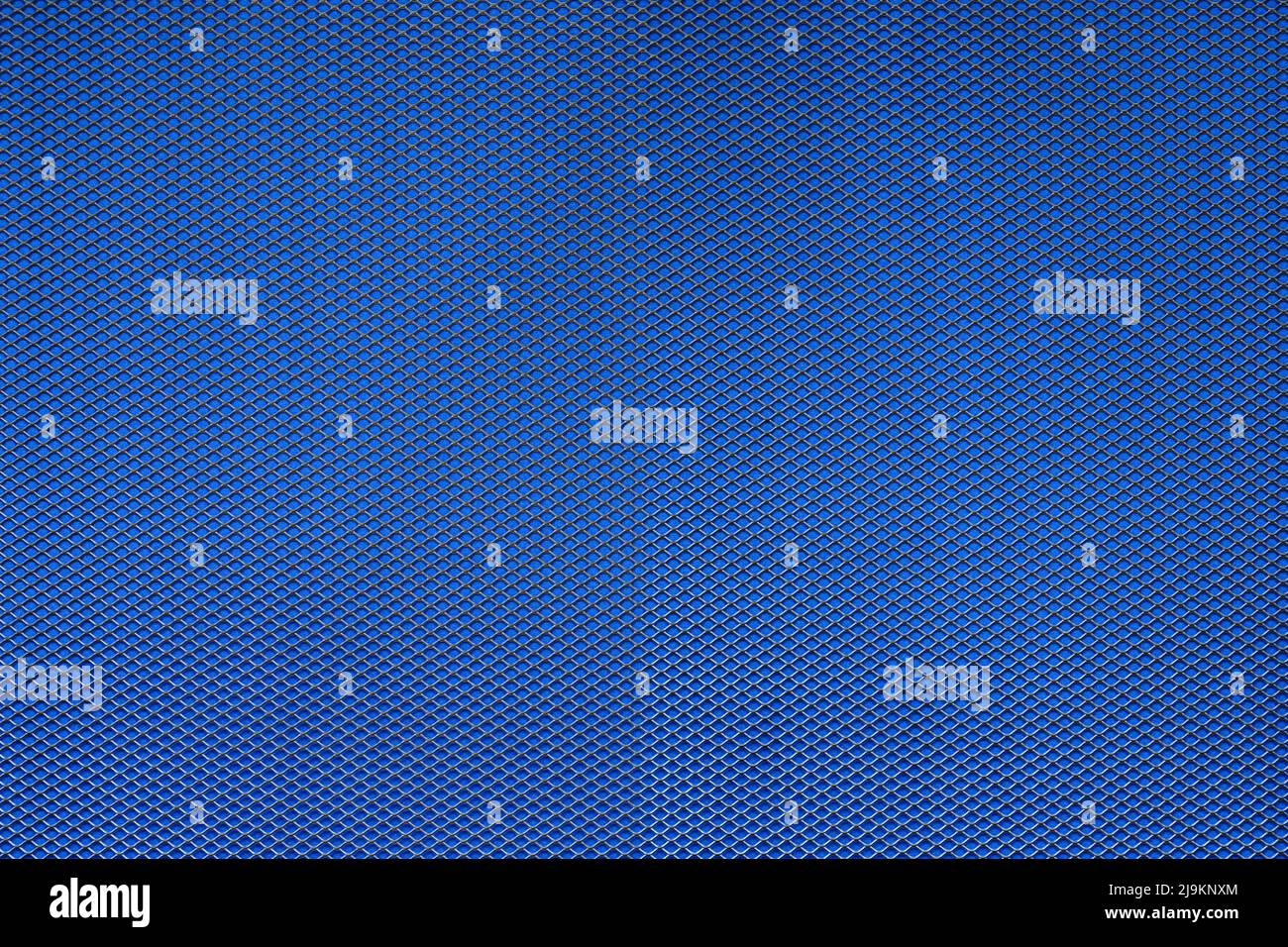 Abstract closeup of metallic background with blue color background ...