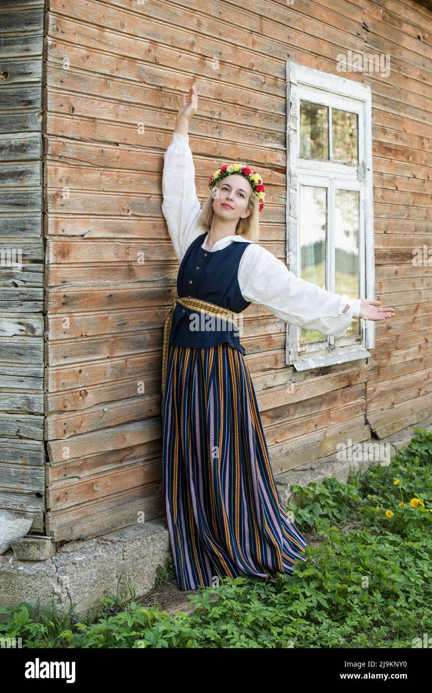 Woman in traditional clothing posing on nature in village Stock Photo ...