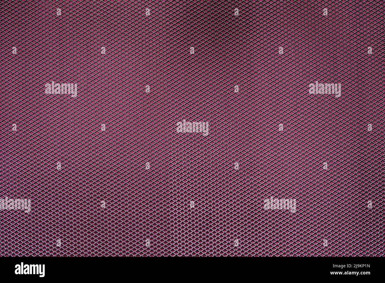 Abstract closeup of metallic background with maroon color background ...