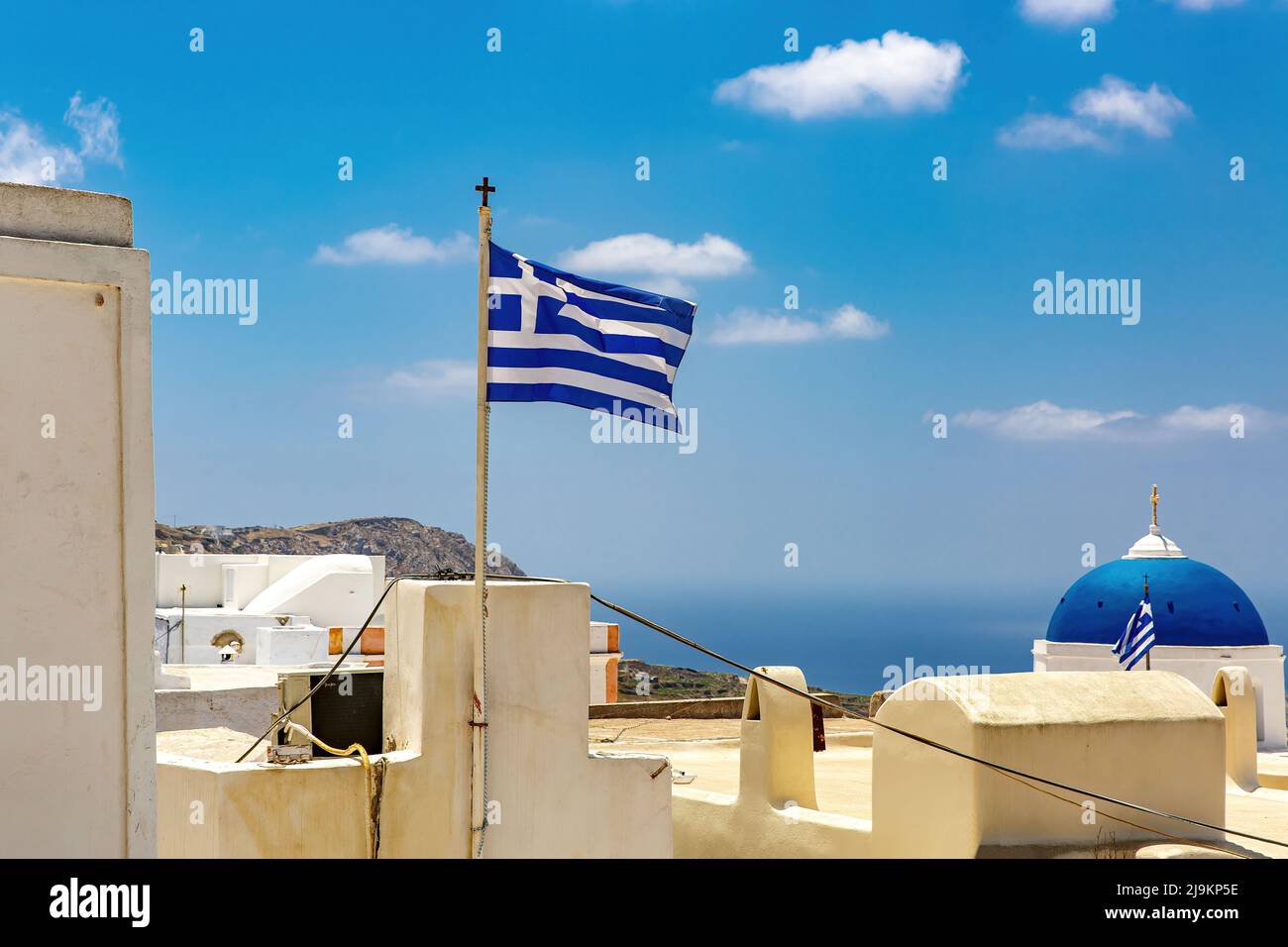 Greece flag over old greek town Stock Photo - Alamy
