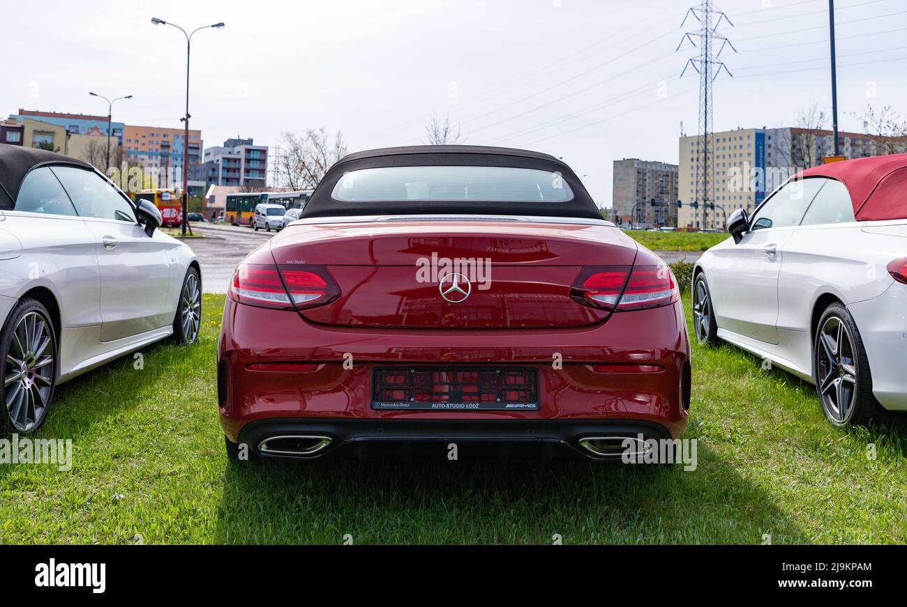 A rear view picture of a red Mercedes Benz Class C Cabrio at a car ...