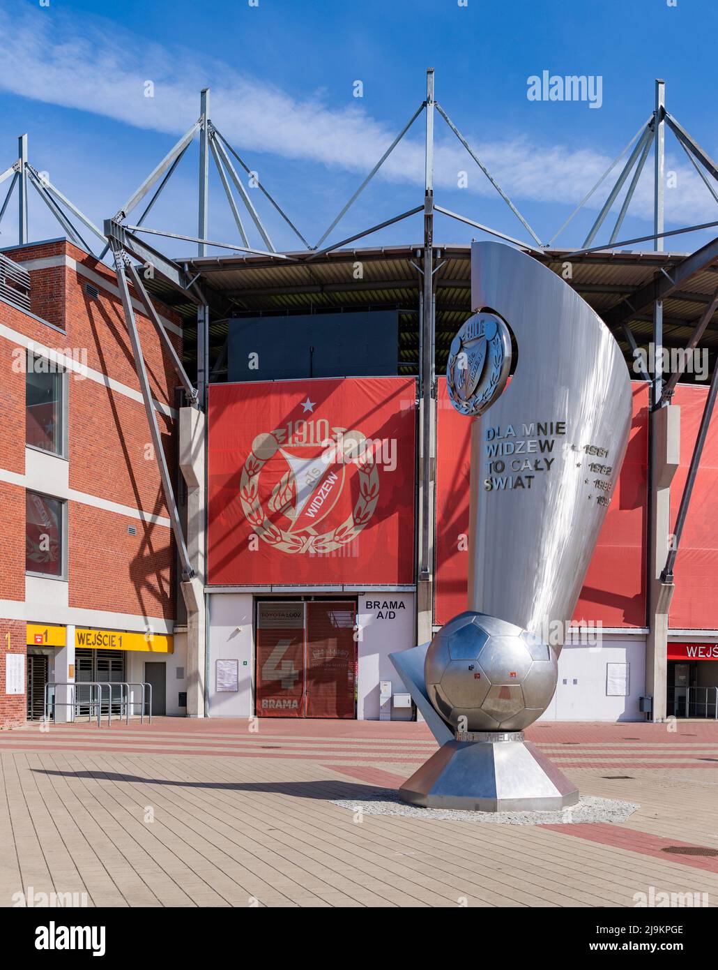 A picture of the Widzew Łódź Stadium and its silver statue ...