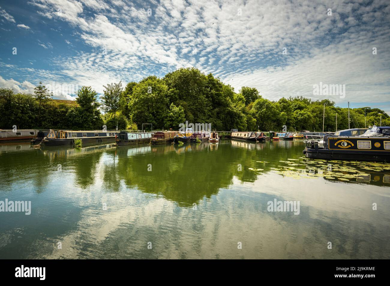 Sharpness Marina, Gloucestershire, with rows of barges moored, on a ...