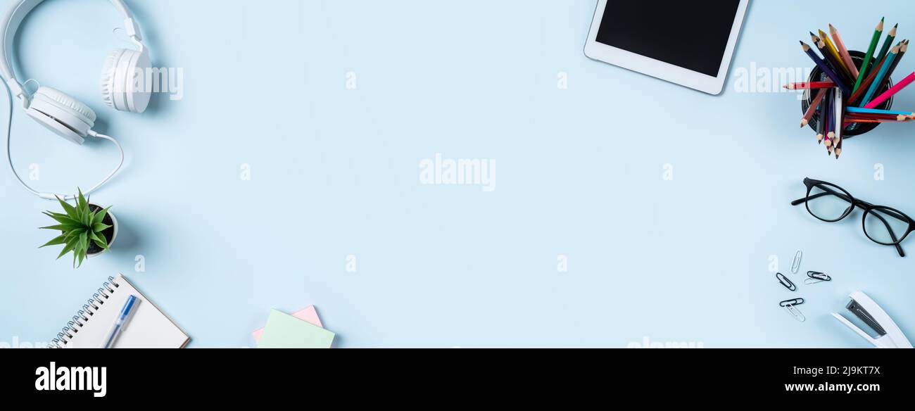 Online learning design concept. Top view of student table with tablet ...