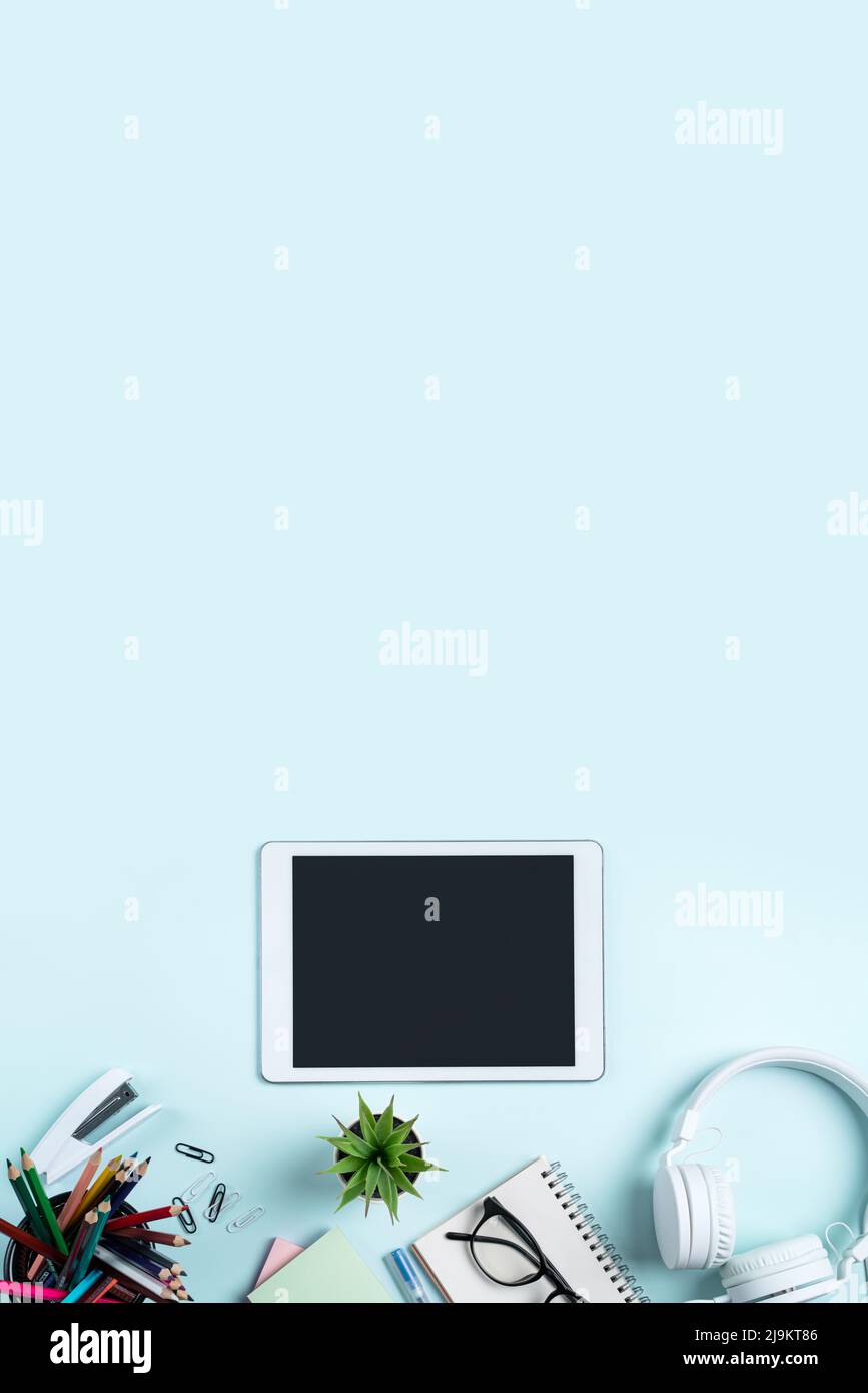 Online learning design concept. Top view of student table with tablet ...