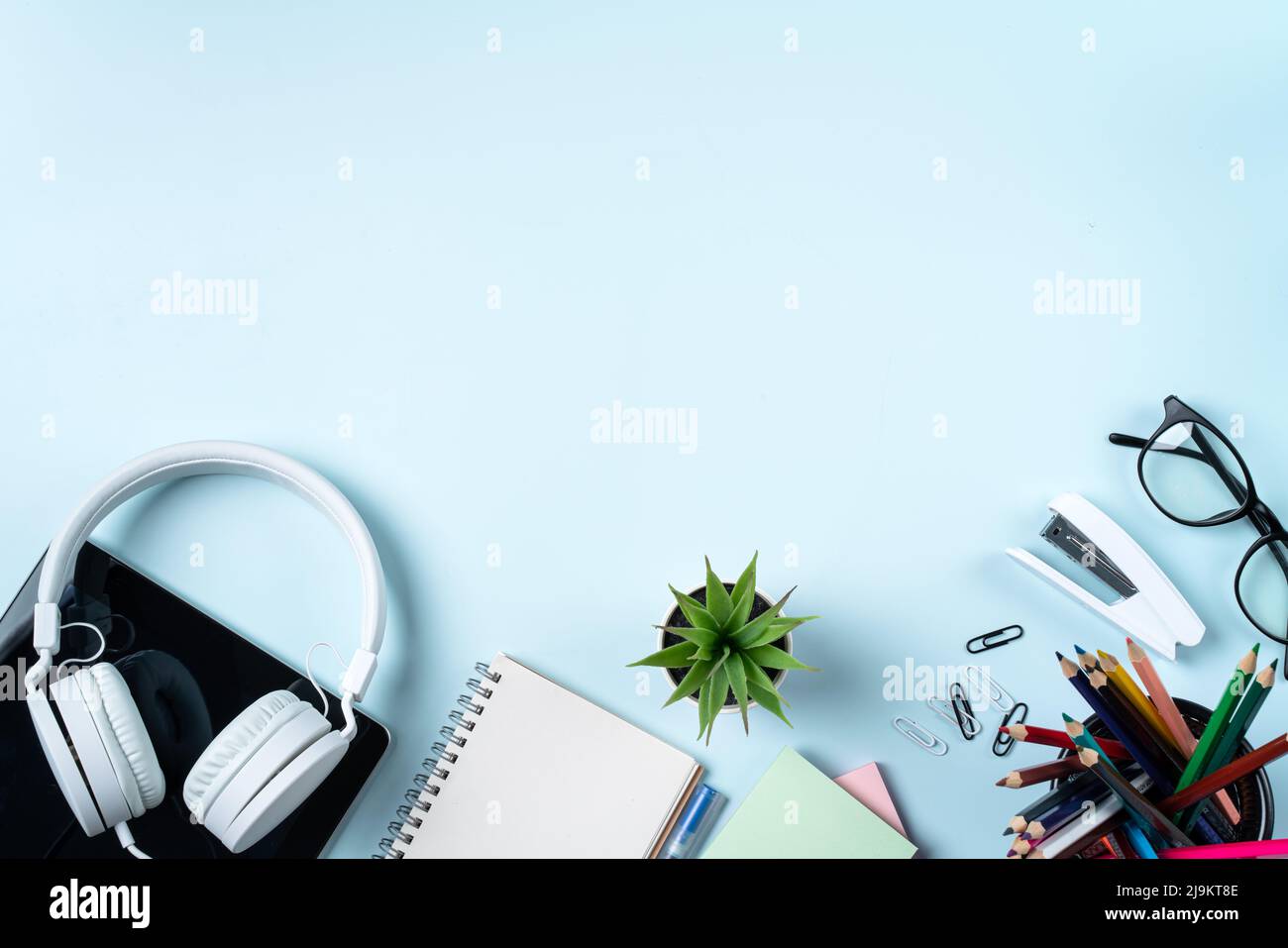 Online learning design concept. Top view of student table with tablet ...