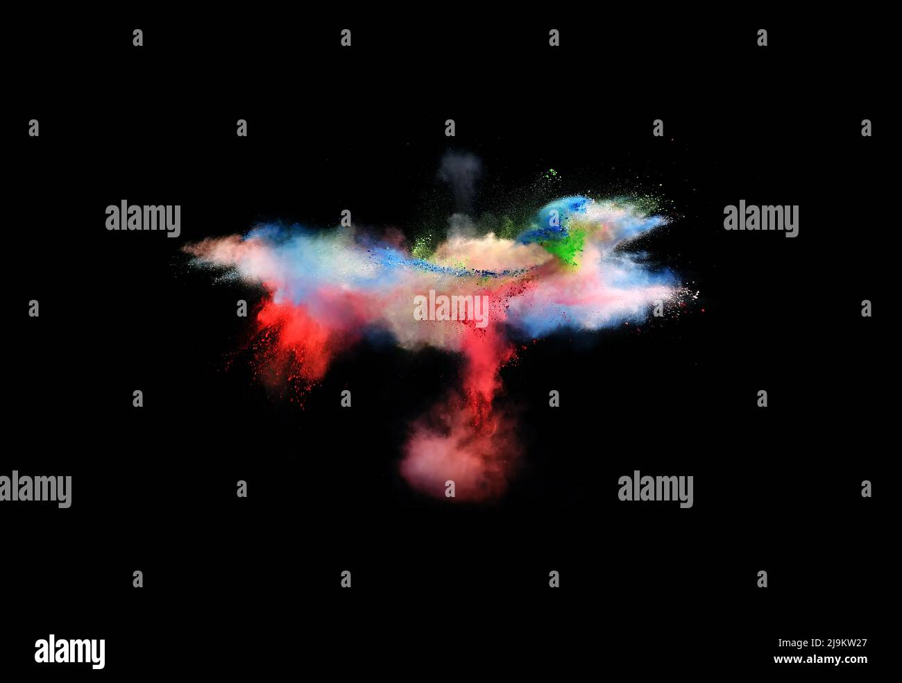 Red, white and blue forms of powder paint combined together explode in ...