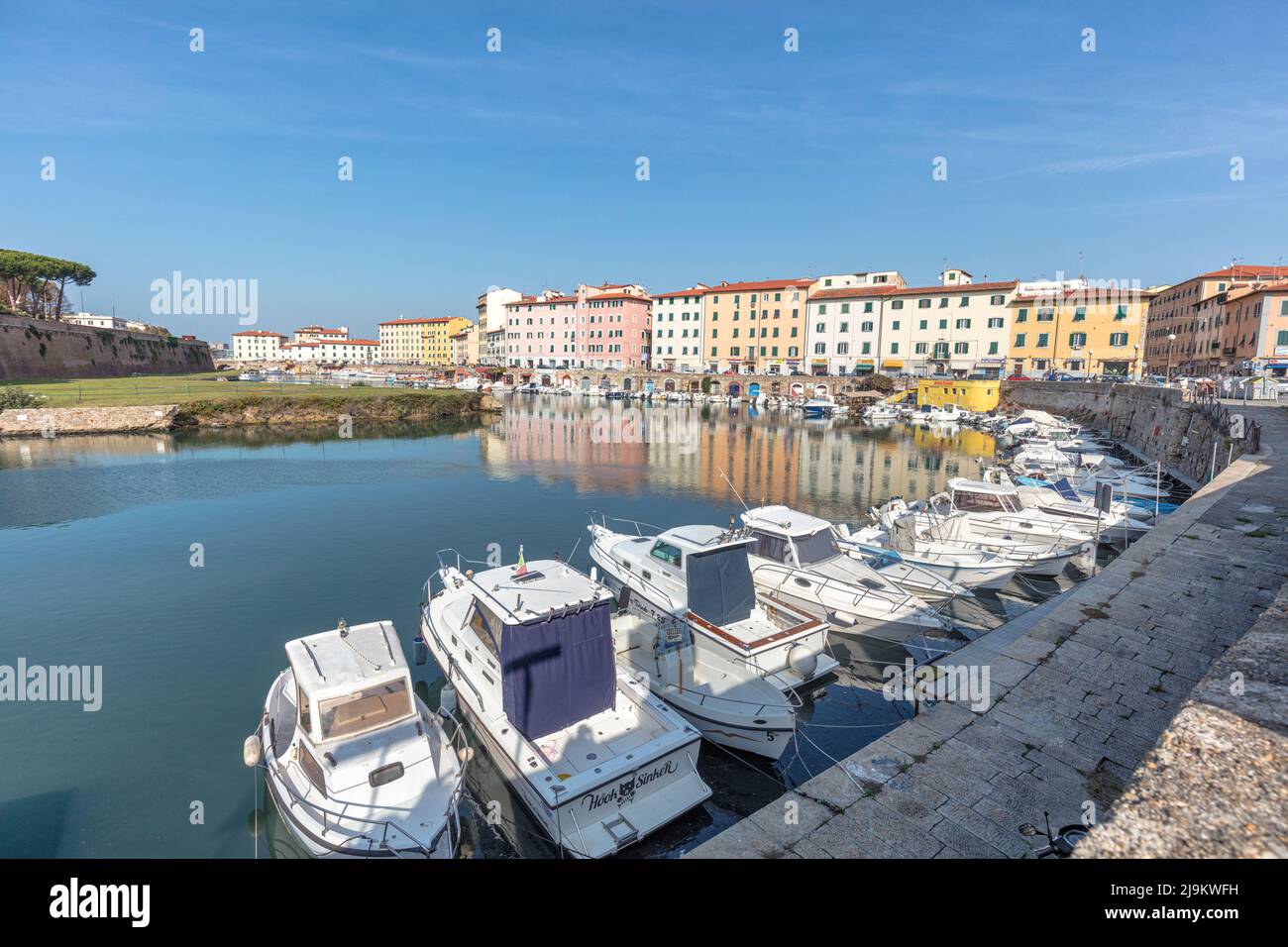 Boats moored in canal by Fortezza Nuova fortress and Via Scali della ...