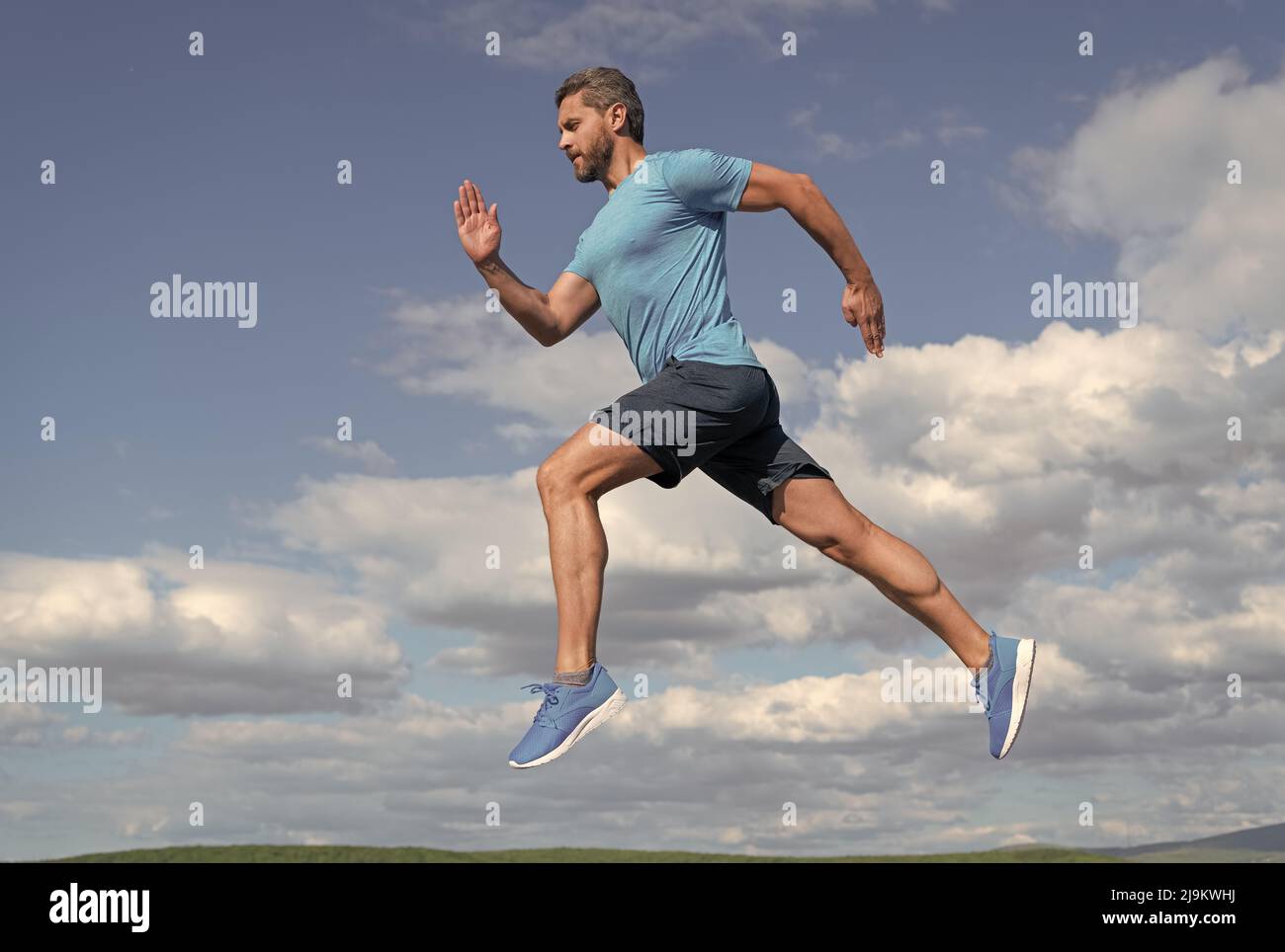healthy sportsman with muscular body running in sportswear outdoor on ...