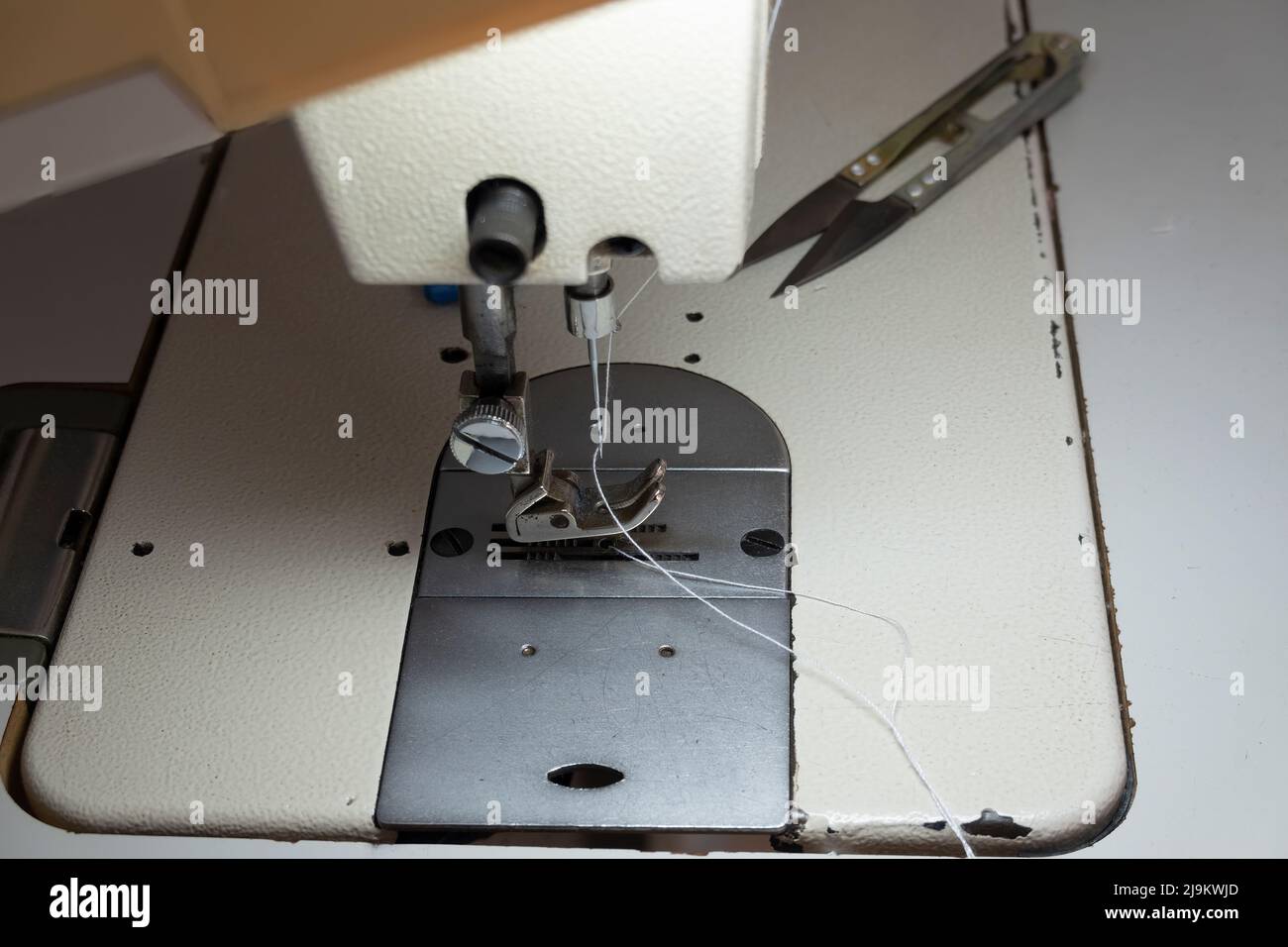 Sewing workshop. Detail of the needle of a sewing machine Stock Photo ...