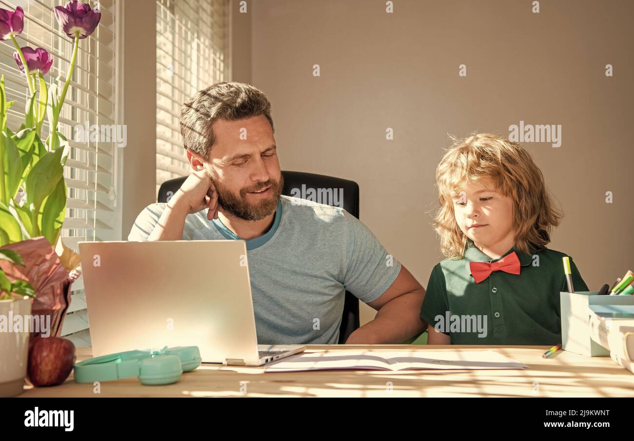 mature man teacher or dad helping kid son with school homework on ...
