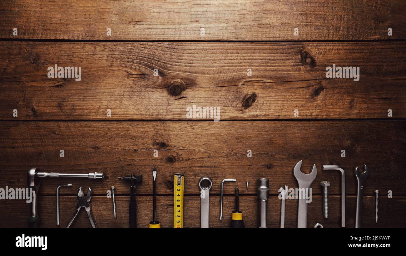 Flat lay with various work tools on wooden background working table ...