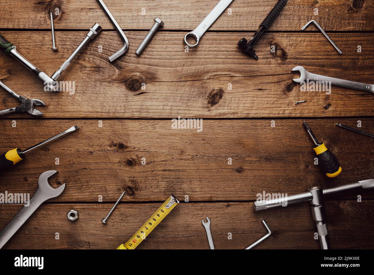 Flat lay with various work tools on wooden background working table ...