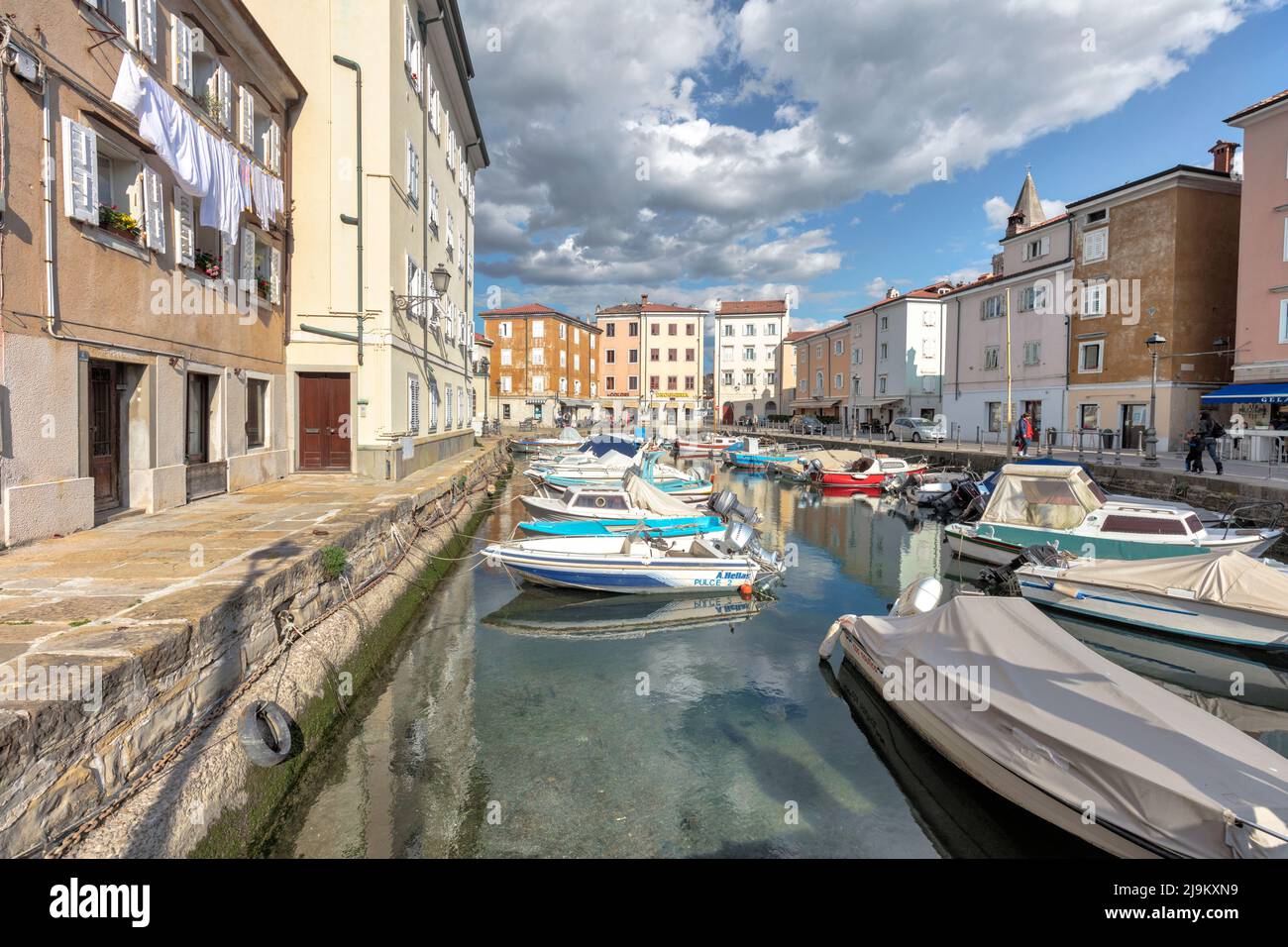 Boats inn the Molo Cristoforo Colombo harbour or wharf in Muggia ...