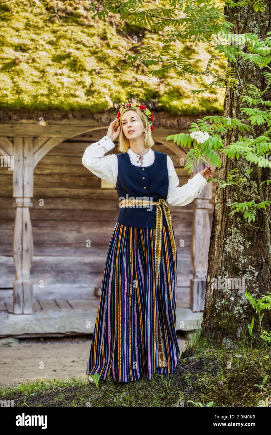 Woman in traditional clothing posing on nature in village Stock Photo ...