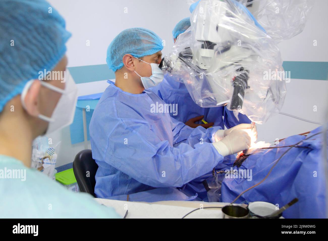 Treatment of a brain aneurysm. Surgical operation on the brain. A team ...