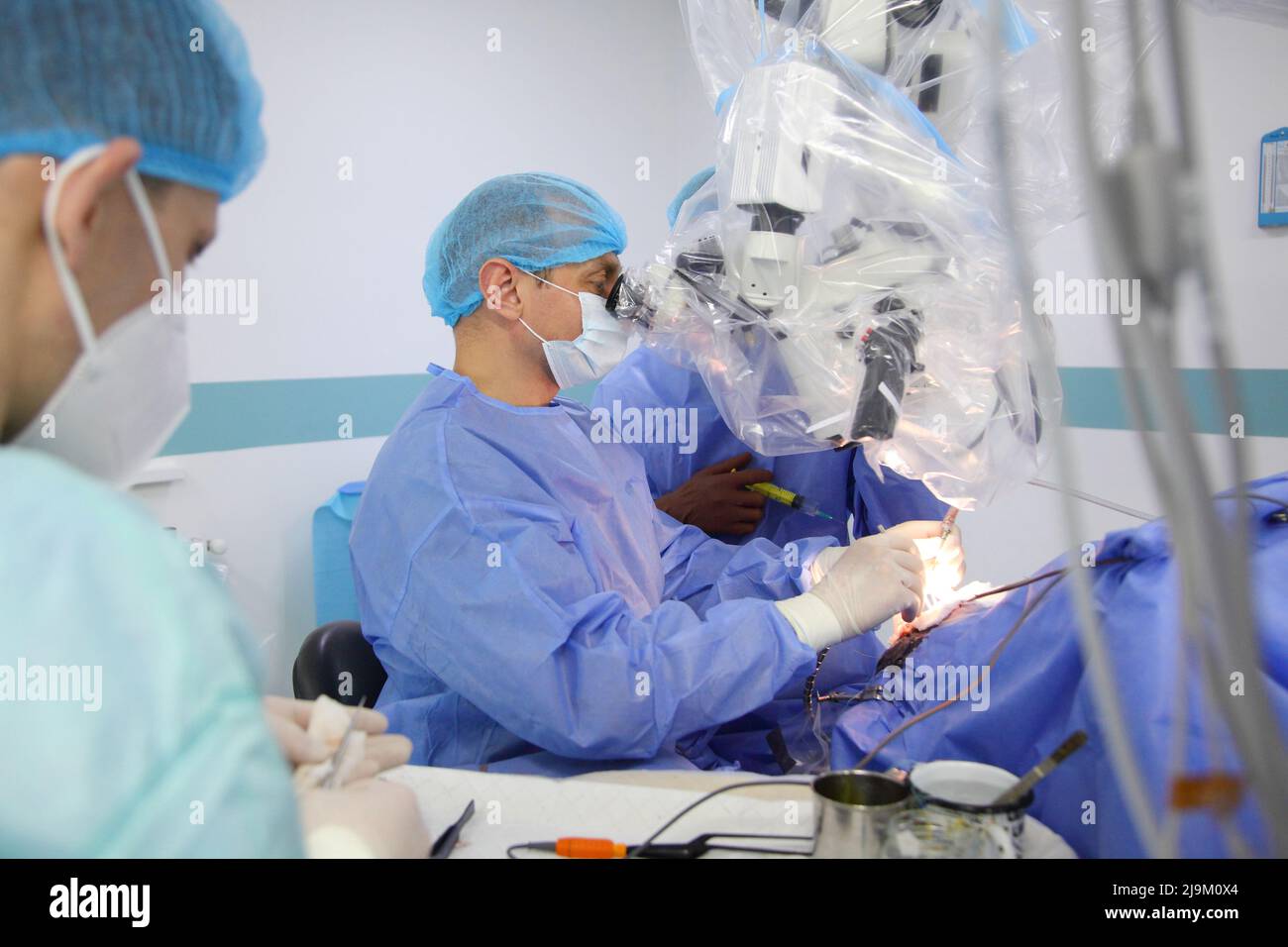 Treatment of a brain aneurysm. Surgical operation on the brain. A team ...