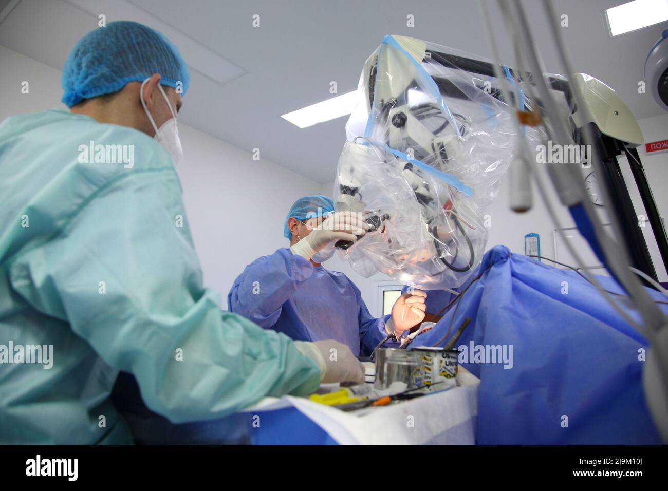 Treatment of a brain aneurysm. Surgical operation on the brain. A team ...