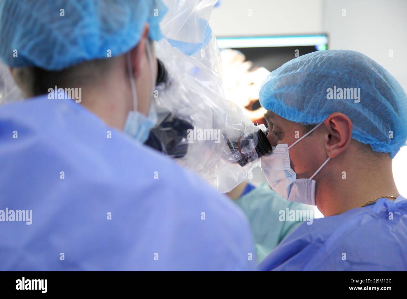 Treatment of a brain aneurysm. Surgical operation on the brain. A team ...