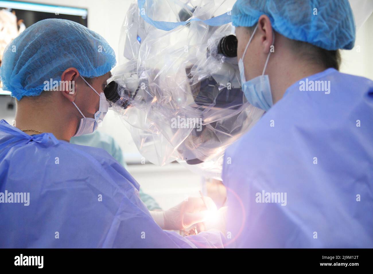 Treatment of a brain aneurysm. Surgical operation on the brain. A team ...