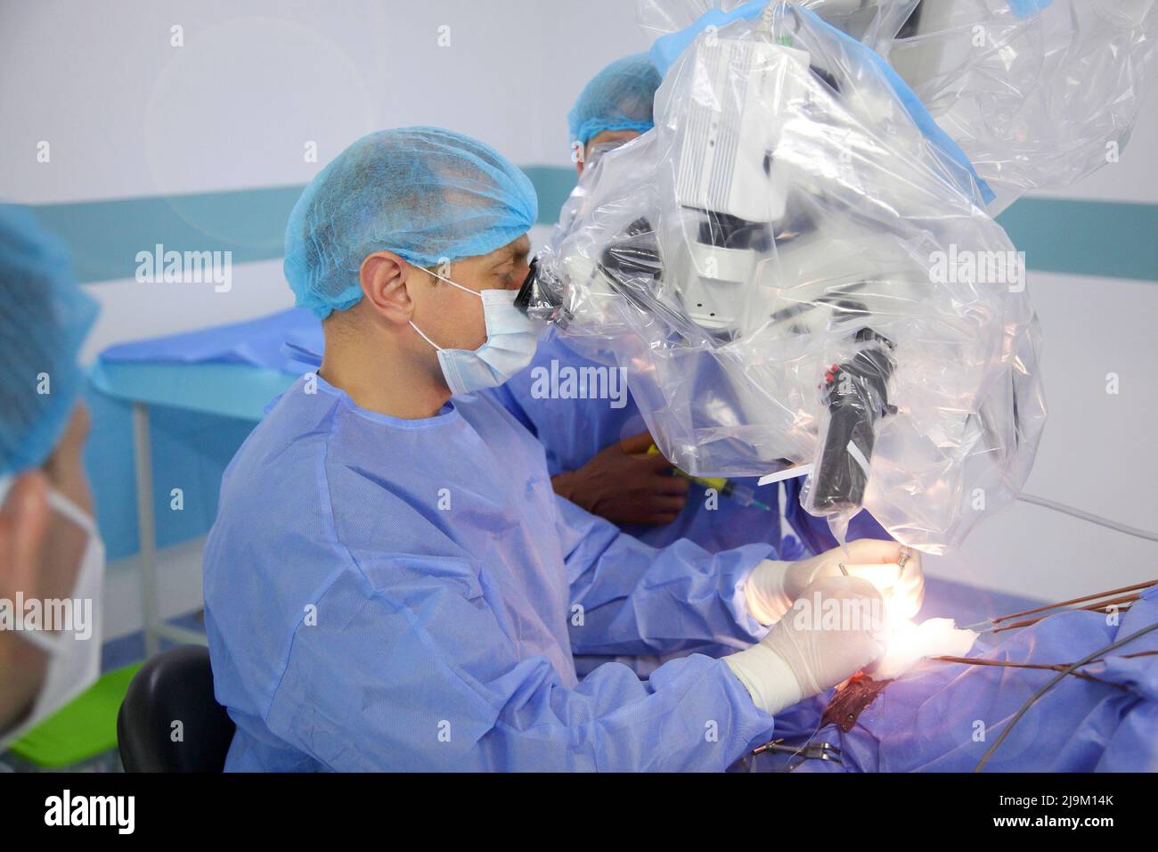 Treatment of a brain aneurysm. Surgical operation on the brain. A team ...