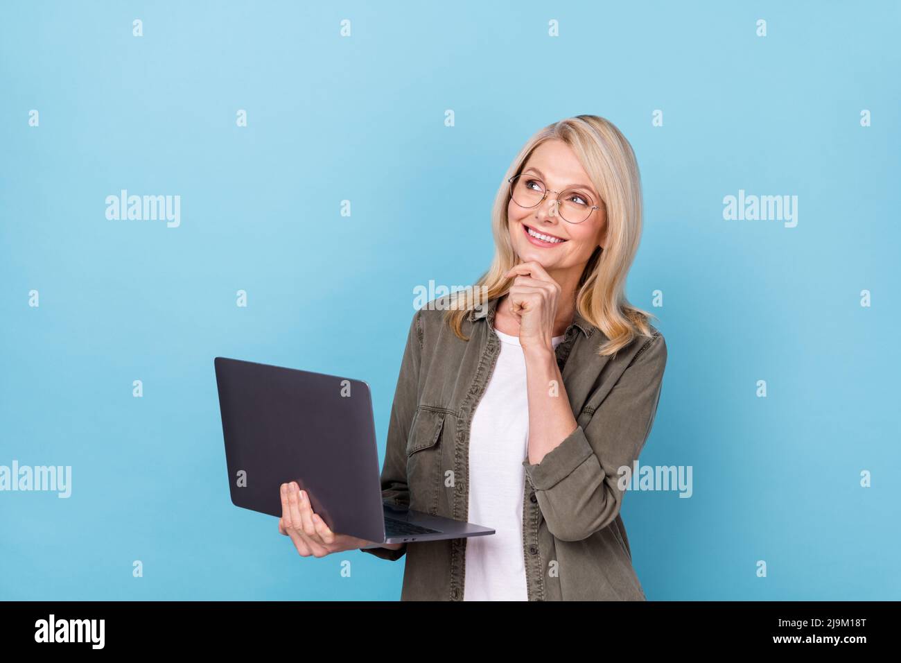 Photo of minded middle aged lady marketer use netbook imagine start up ...