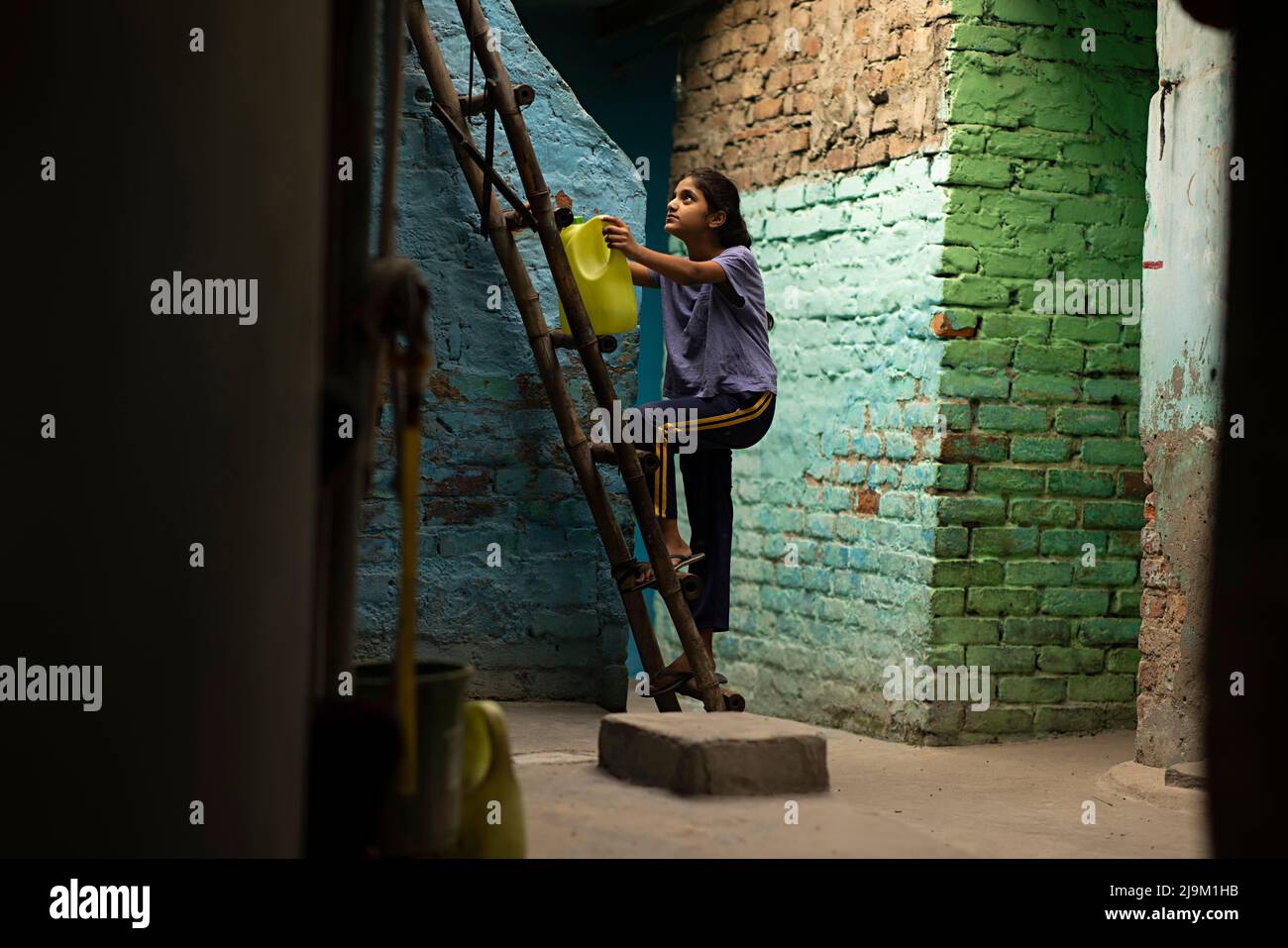 Child up ladder hi-res stock photography and images - Alamy