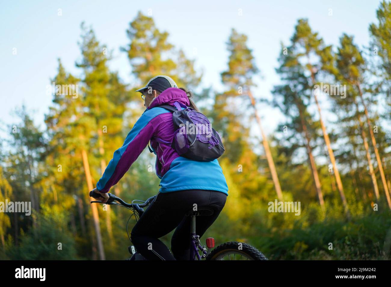 Woman and back view bike hi-res stock photography and images - Alamy