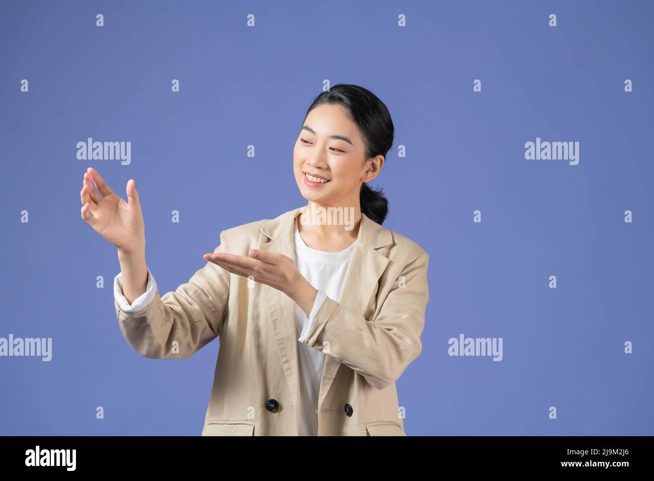 girl holds something invisible Stock Photo - Alamy