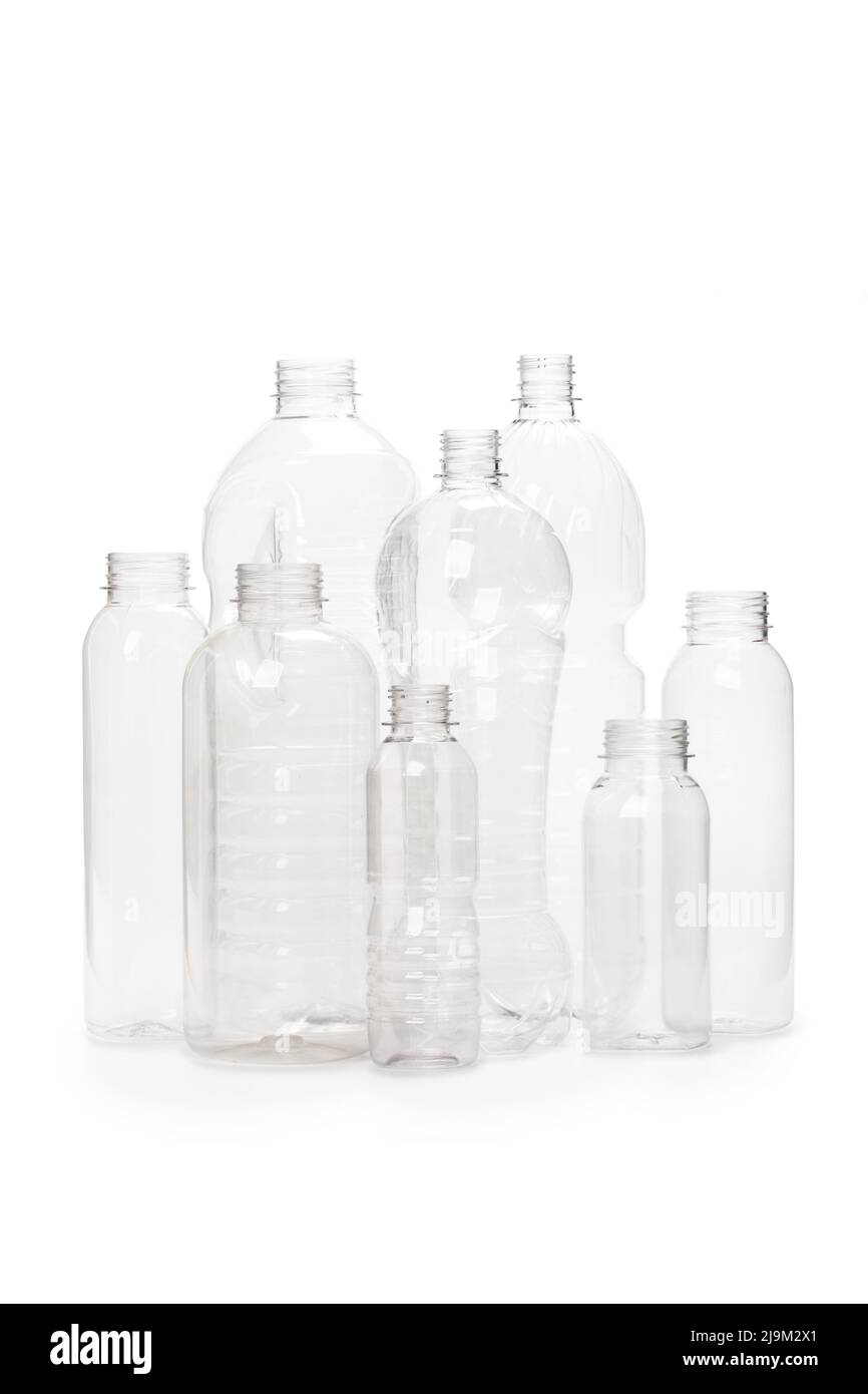 many different empty plastic bottles isolated on white background ...